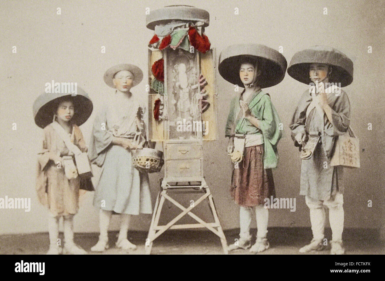 Kusakabe Kimbei - pilgrim priests with portable shrine Stock Photo - Alamy