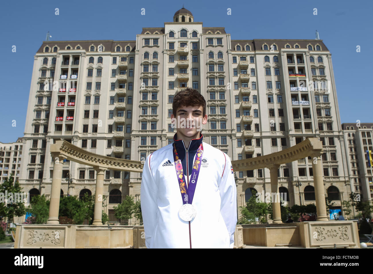 Ross Haslam (GBR) poses with his medal. Athletes Village Main Square ...