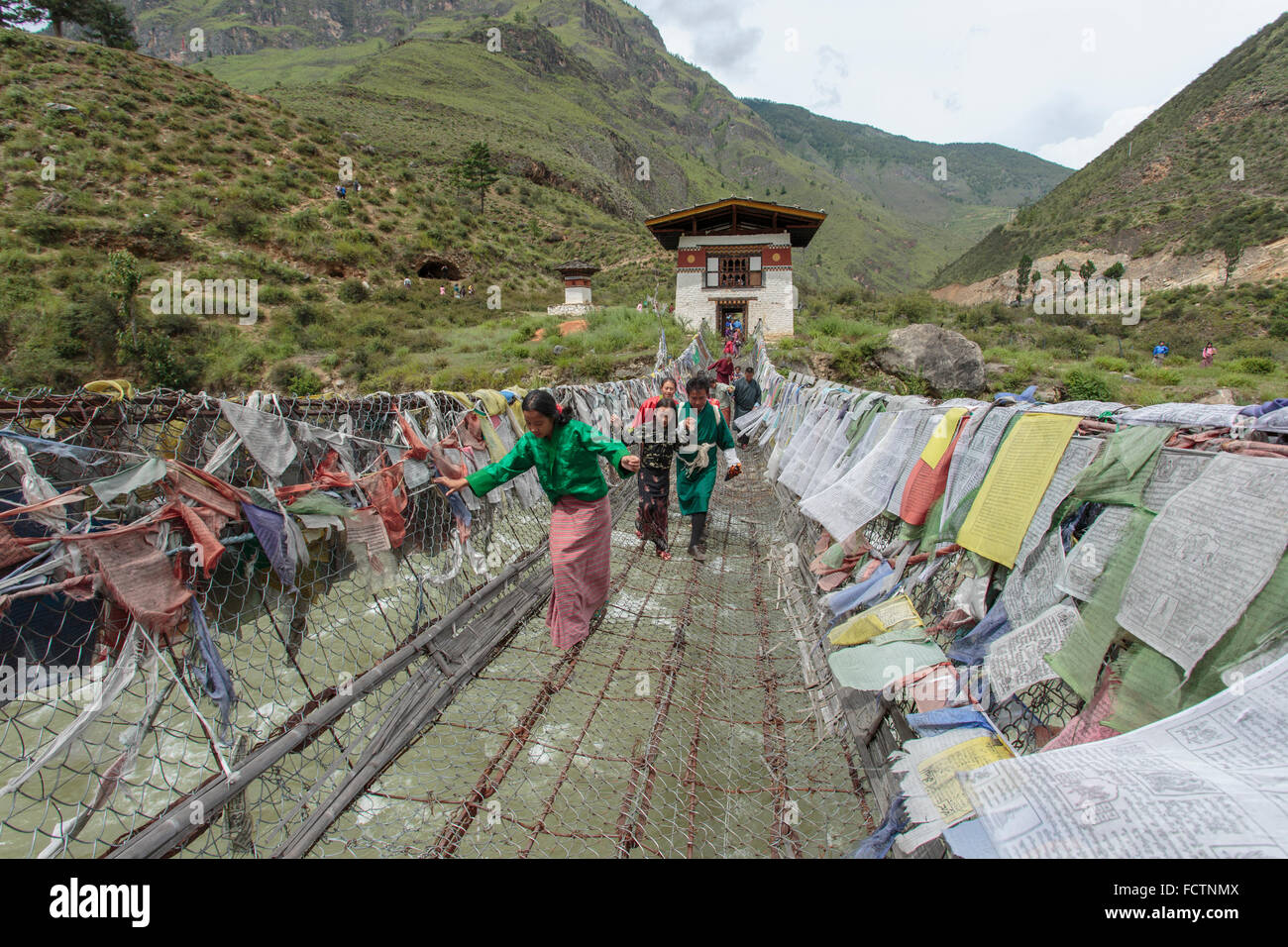 Crossing a wire suspension bridge in Bhutan, between Paro and Thimphu ...