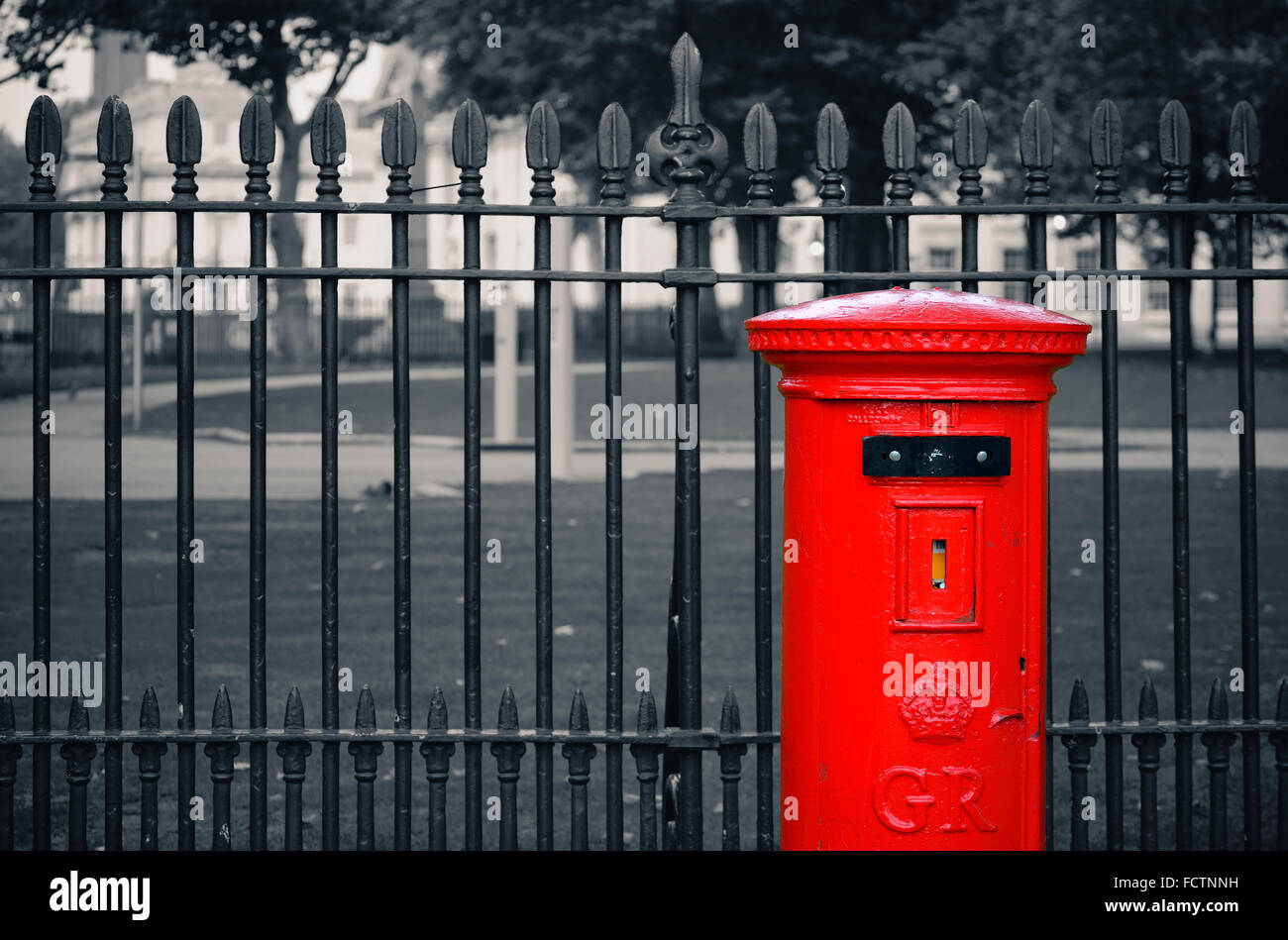Red post box in street with historical architecture in London Stock ...