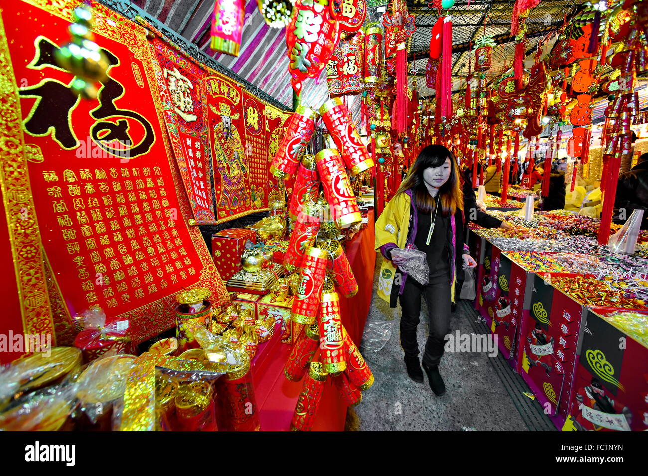 Taipei's Taiwan. 25th Jan, 2016. A woman walks past lunar New Year ...