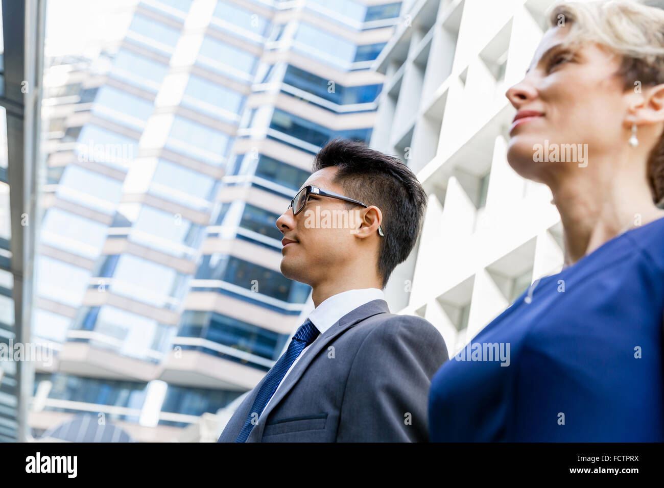 Businessteam members standing next to each other in business district ...
