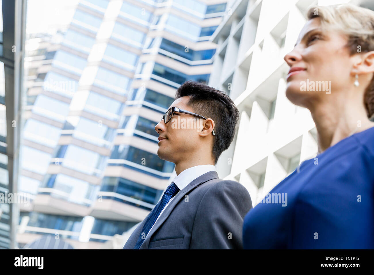 Businessteam members standing next to each other in business district ...