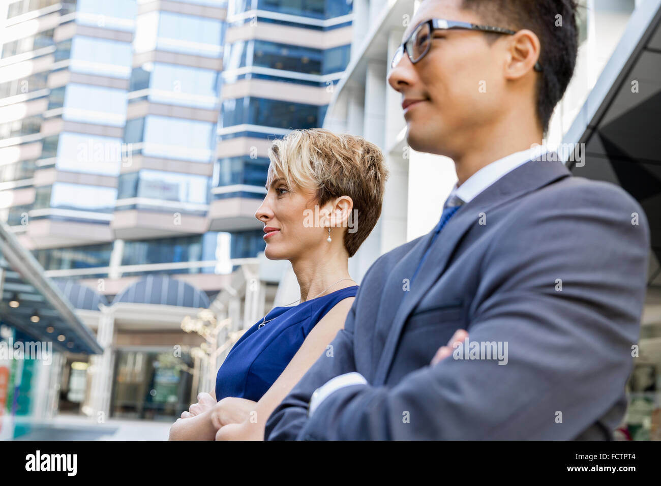 Businessteam members standing next to each other in business district ...