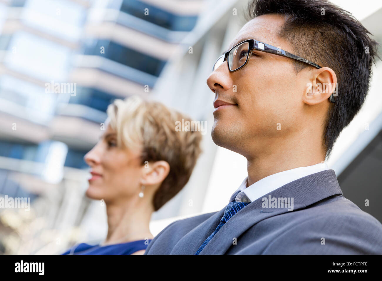 Businessteam members standing next to each other in business district ...