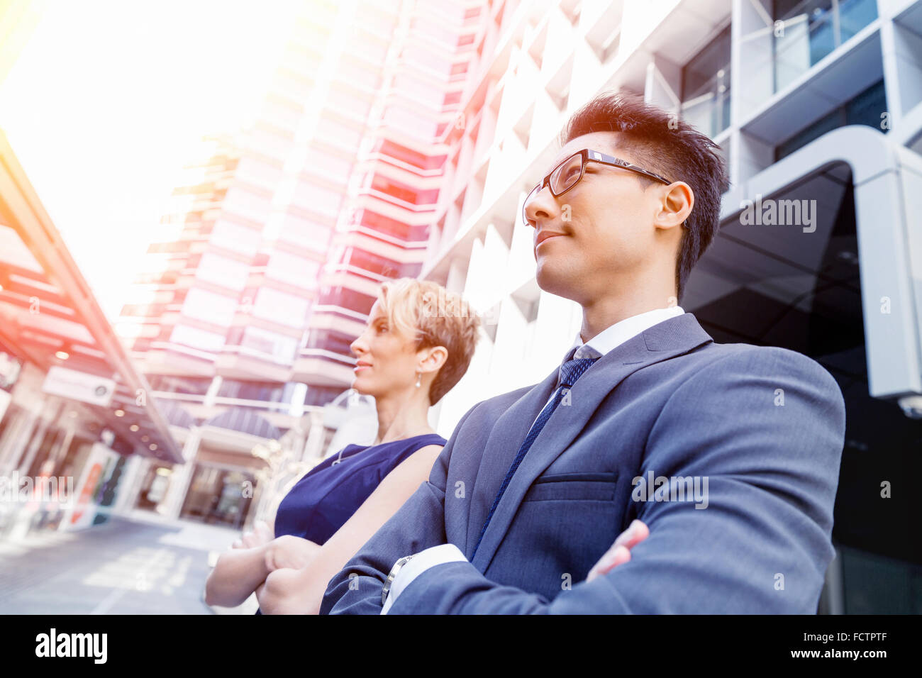 Businessteam members standing next to each other in business district ...