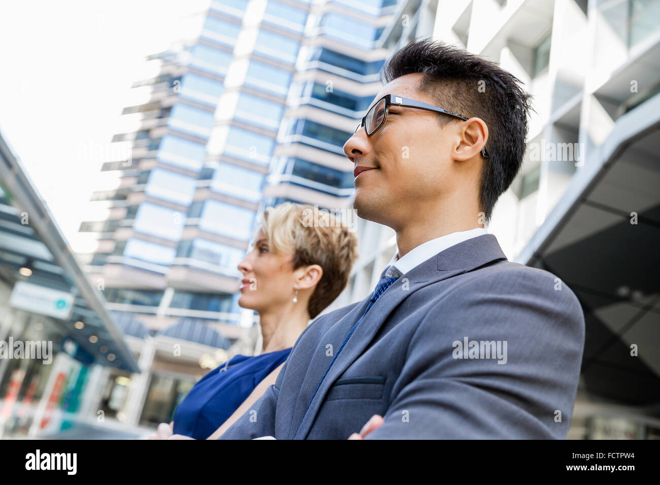 Businessteam members standing next to each other in business district ...