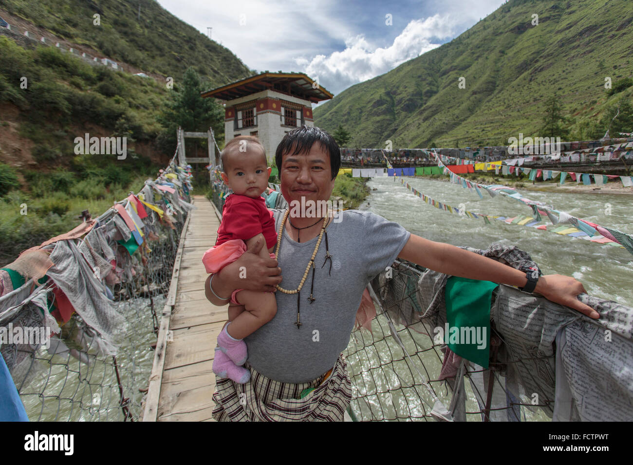 Father and Child crossing a wire bridge near Thimphu in Bhutan Stock ...