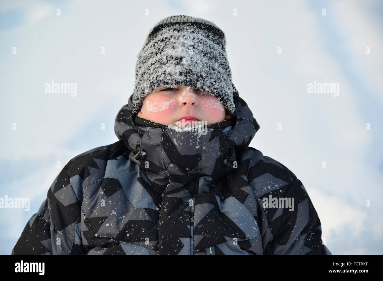 Portrait of frozen boy in winter Stock Photo - Alamy