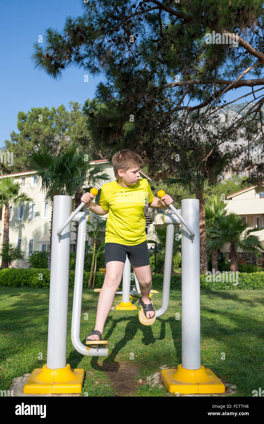 Boy doing fitness trainers on street Stock Photo - Alamy