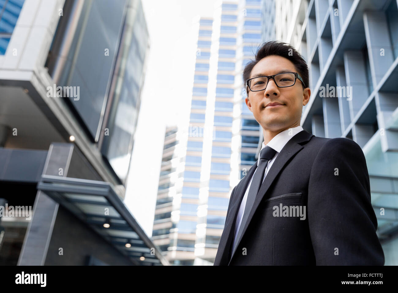 Businessman outdoors in city business district Stock Photo - Alamy