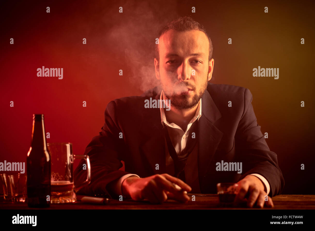 Young businessman smoking cigarette hi-res stock photography and images ...