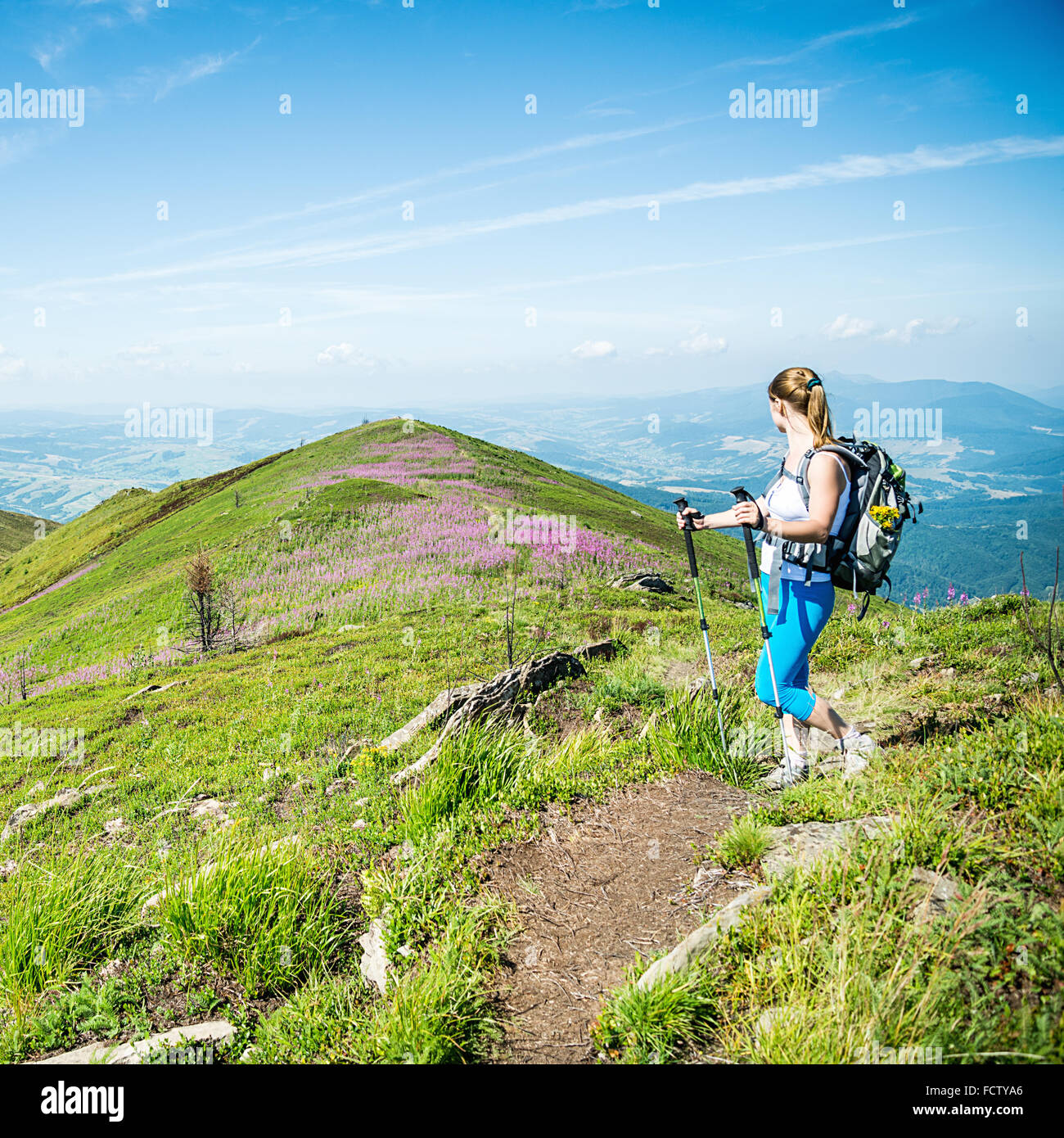 Young woman hiking in the mountains Stock Photo - Alamy