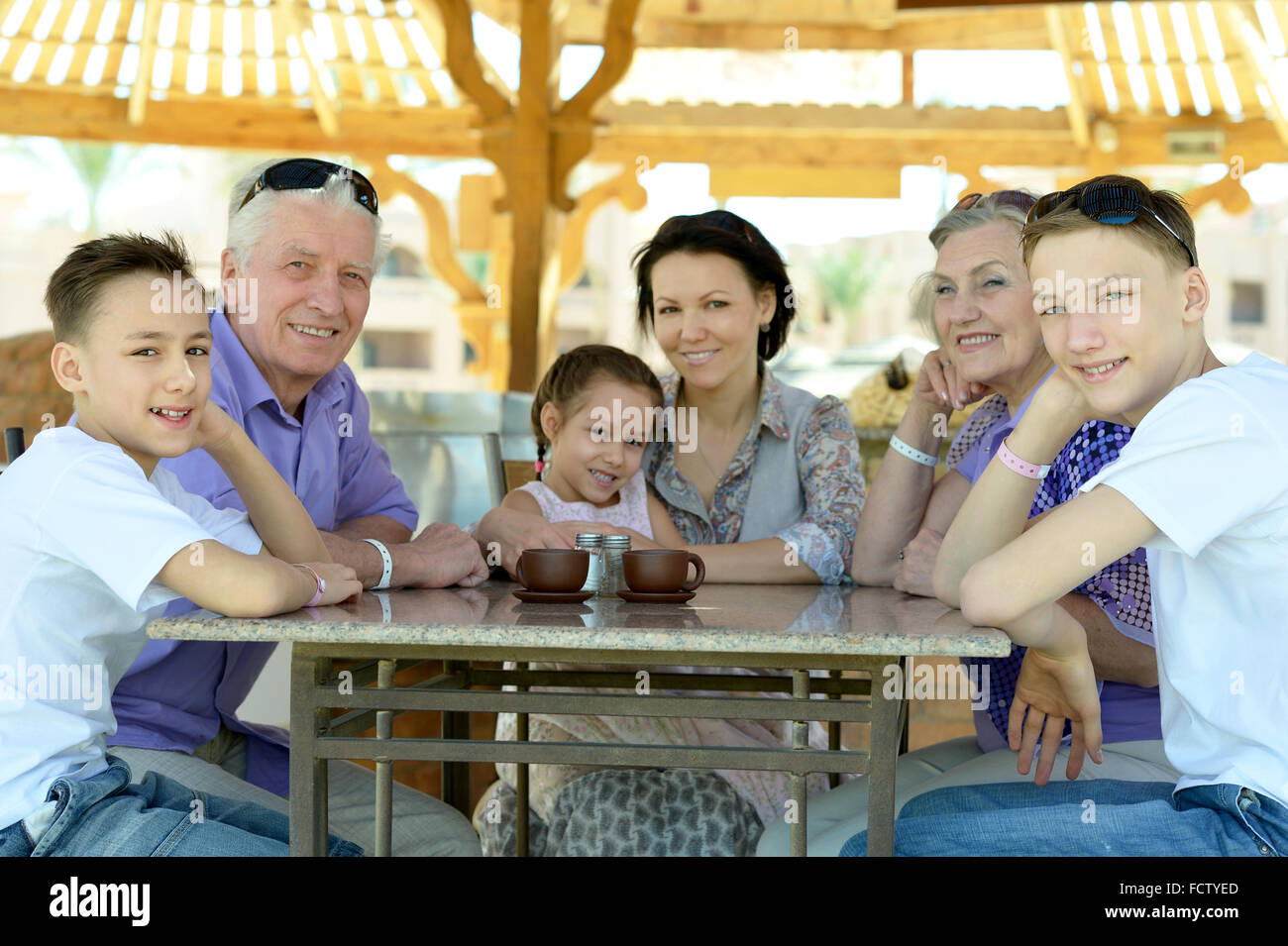 Happy family with coffee Stock Photo - Alamy