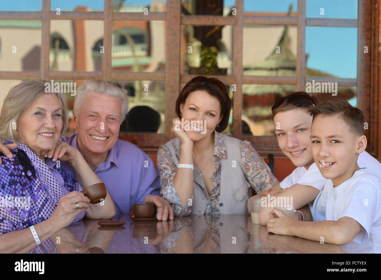 Happy family with coffee Stock Photo - Alamy