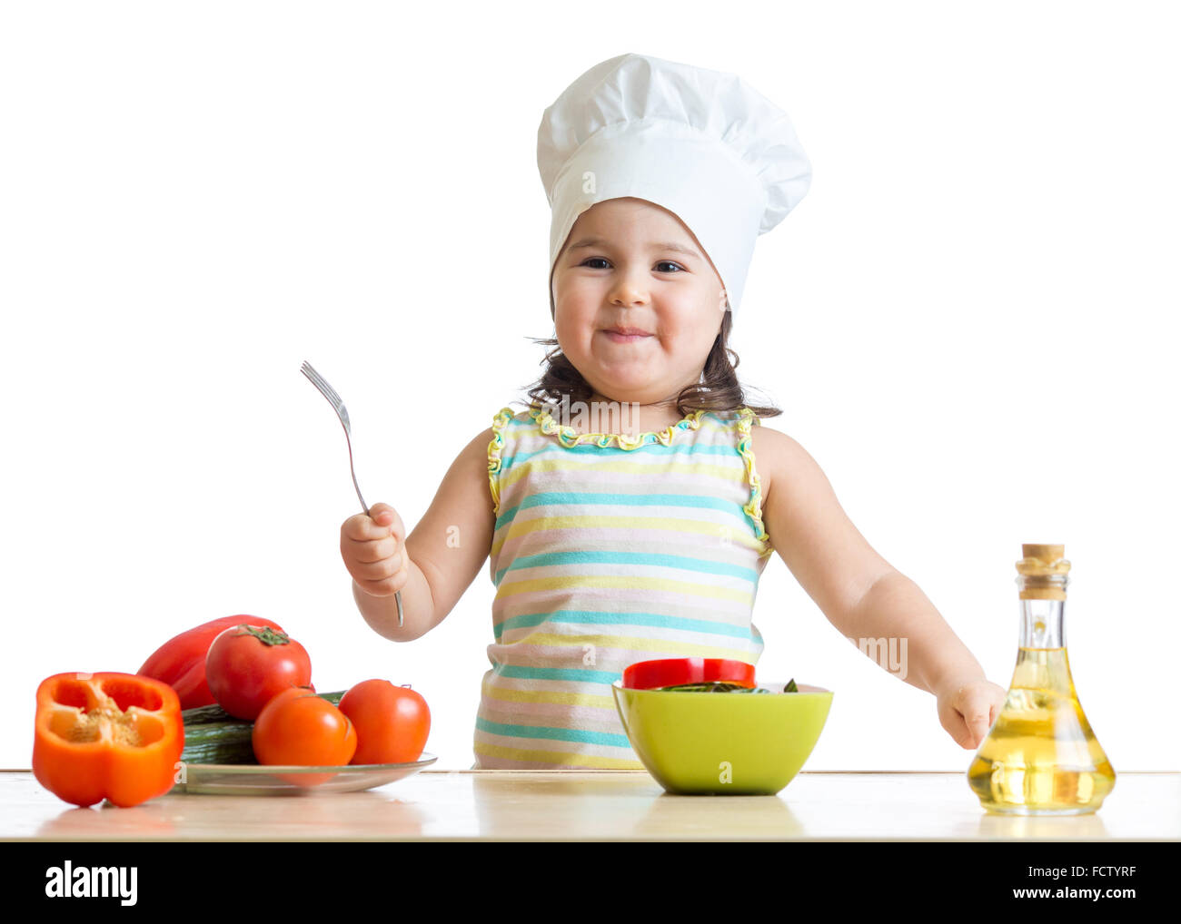 child girl chef cook with fresh vegetables, healthy eating concept ...