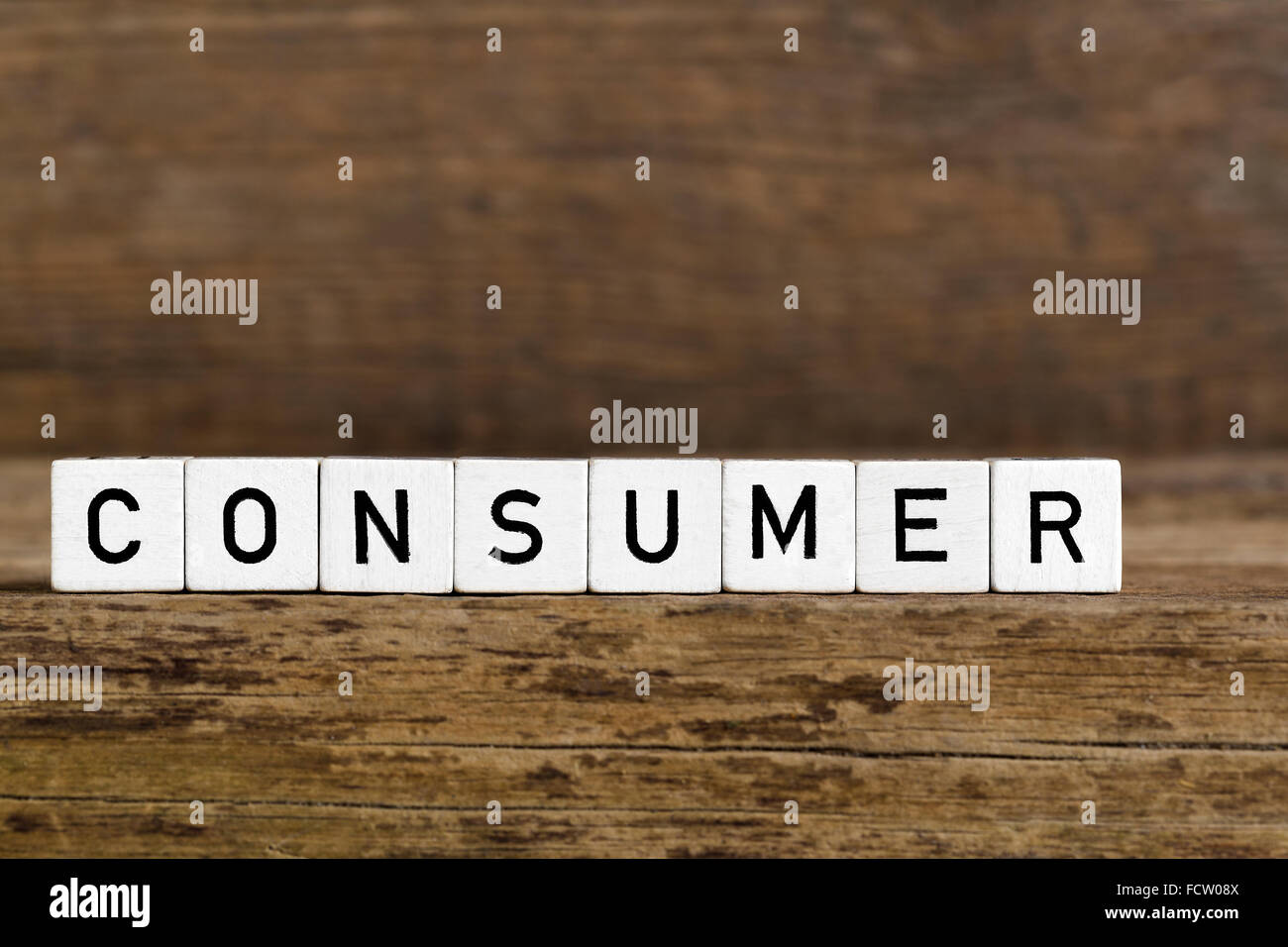 The word consumer written in cubes on wooden background Stock Photo - Alamy