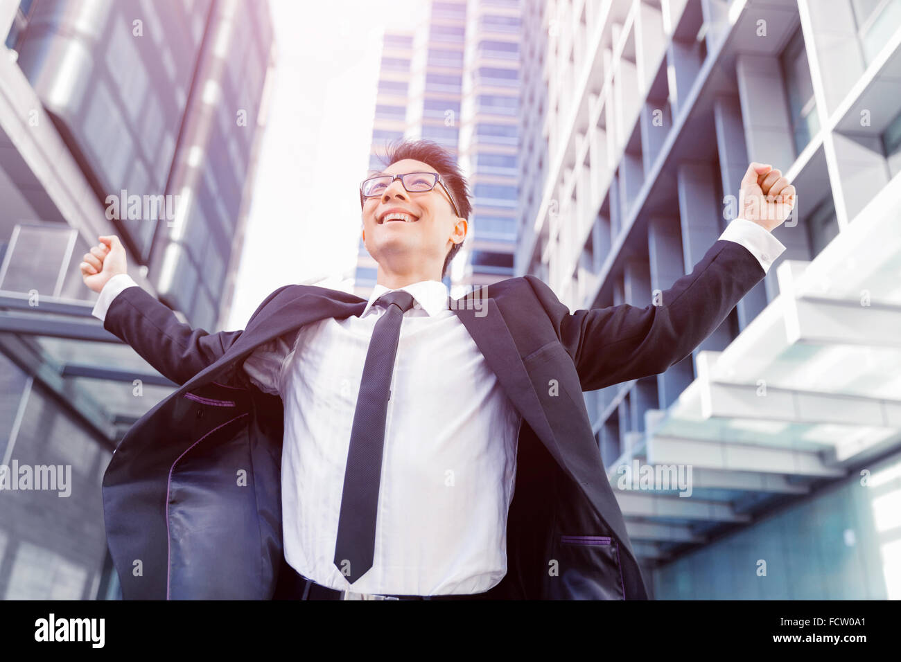 Businessman standing in street with his arms open Stock Photo - Alamy