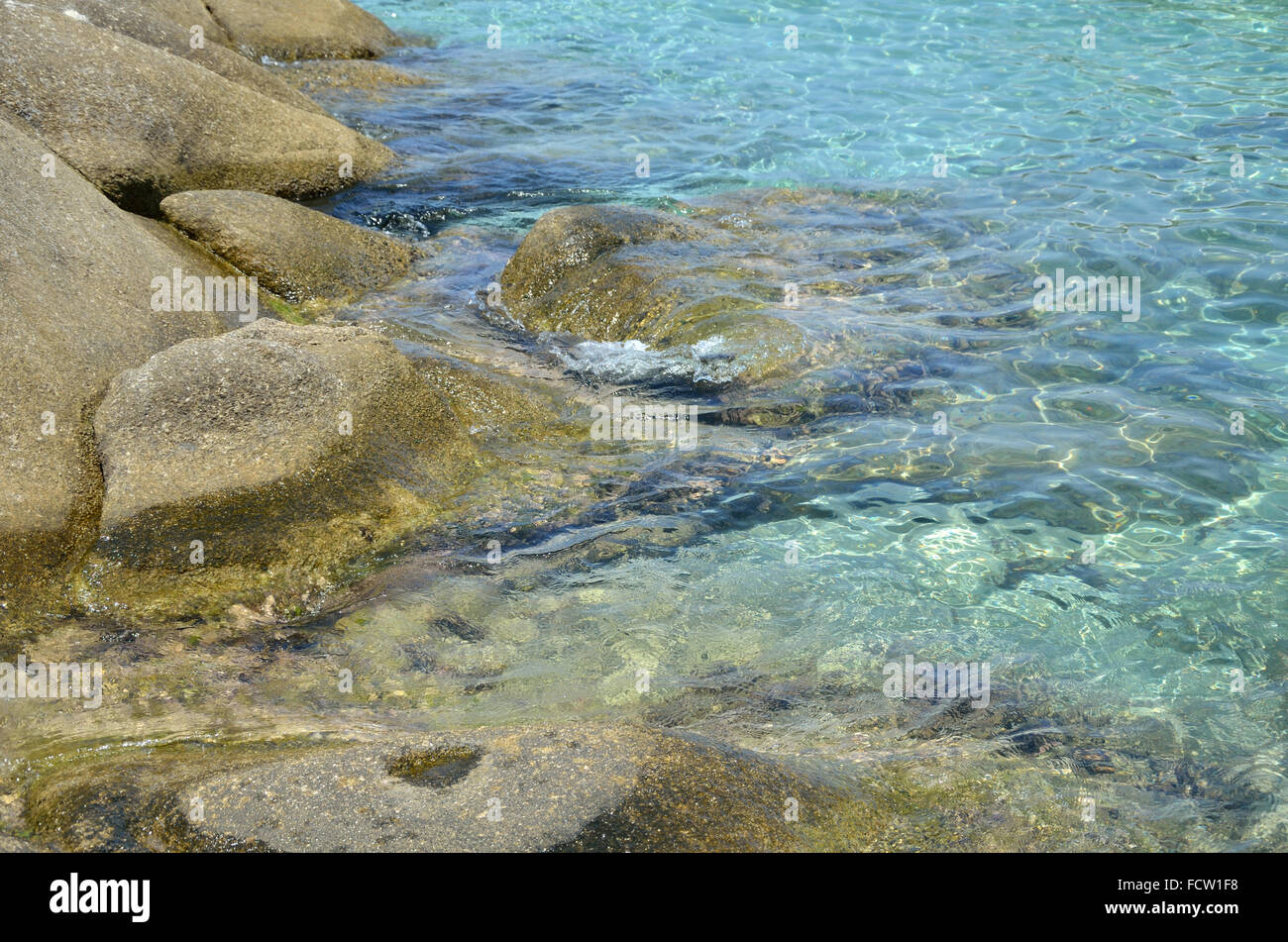Sparkling transparent turquoise sea water and stones Stock Photo - Alamy