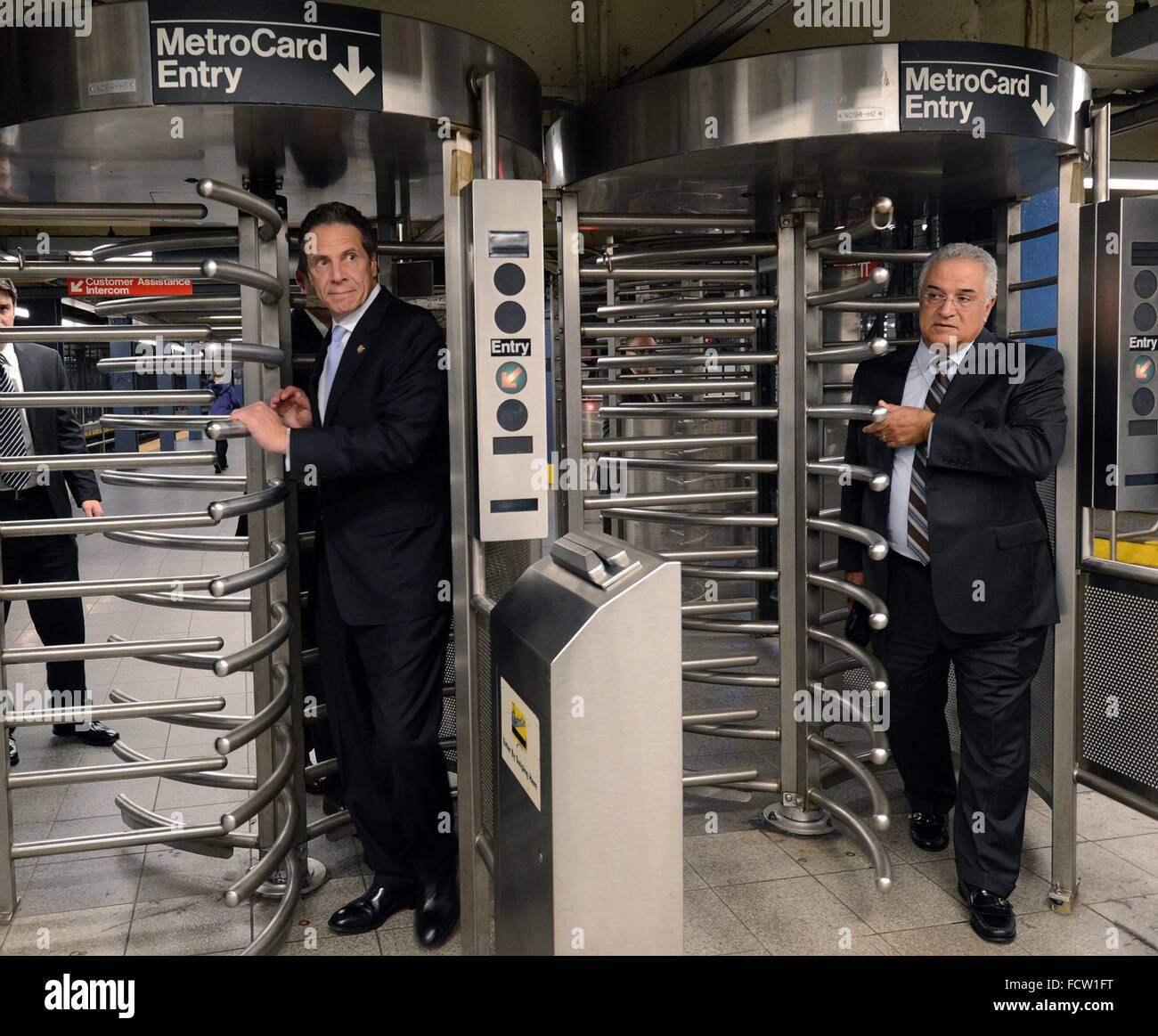 New York Governor Andrew Cuomo walks through a subway turnstile after ...
