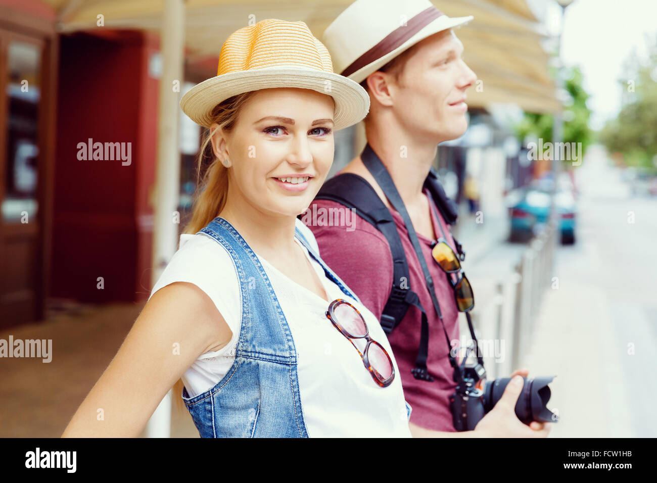 Happy young couple exploring city Stock Photo - Alamy