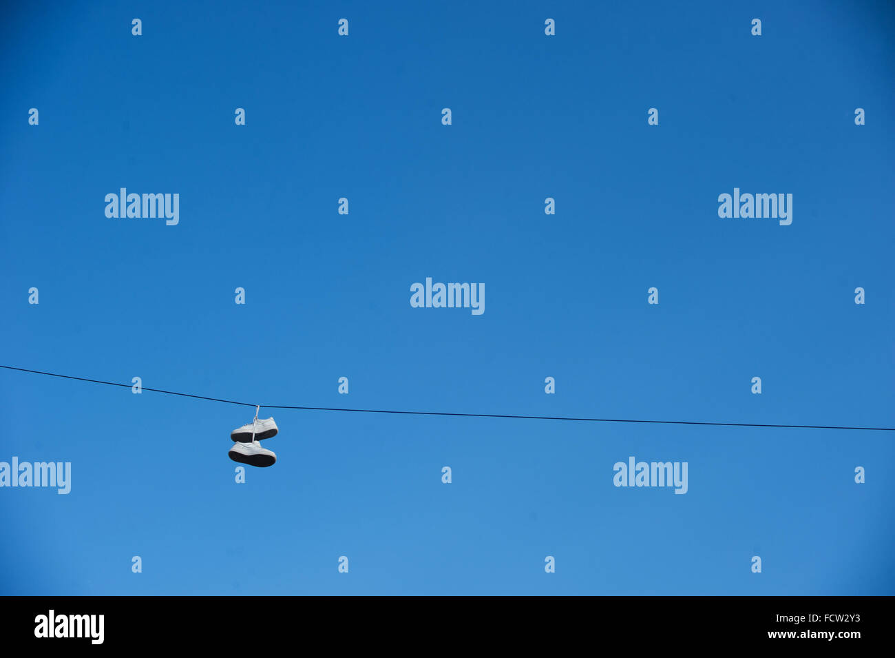 Sneakers hanging telephone wire hi-res stock photography and images - Alamy