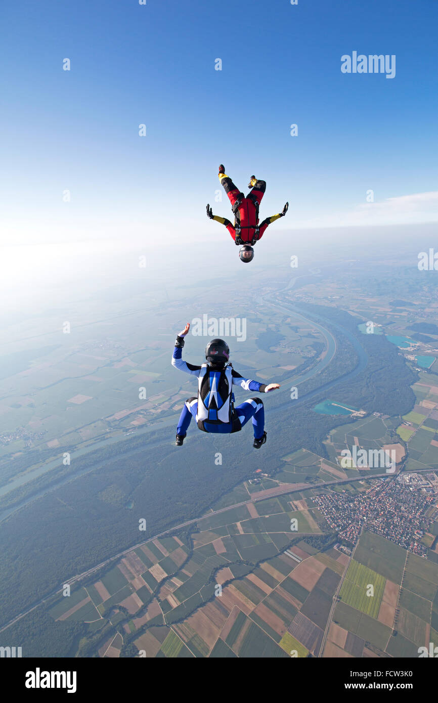 Two freefly skydivers are training the sit- & head-down formation ...