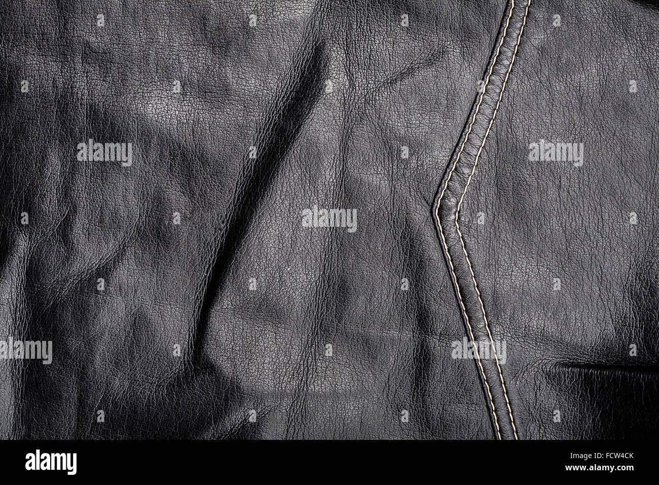 Crumpled worn leather texture with a seam Stock Photo - Alamy