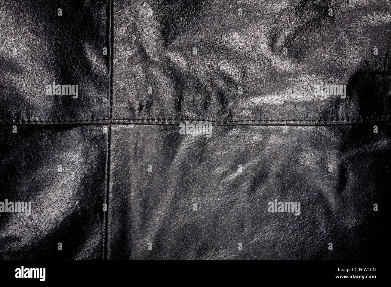 Crumpled worn leather texture with a seam Stock Photo - Alamy