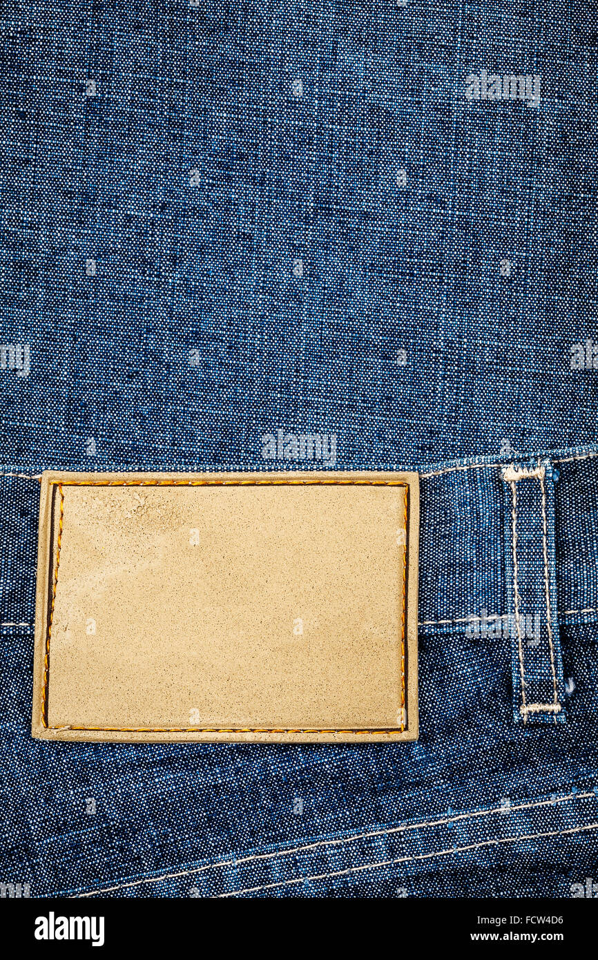 Blank leather jeans label on a blue jeans texture Stock Photo - Alamy