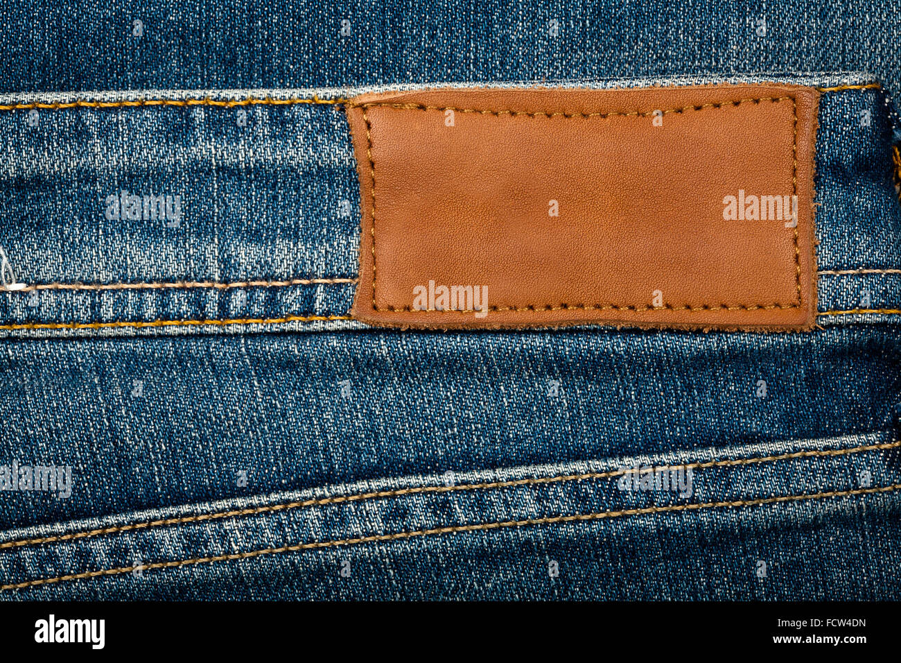 Blank leather jeans label on a blue jeans texture Stock Photo - Alamy