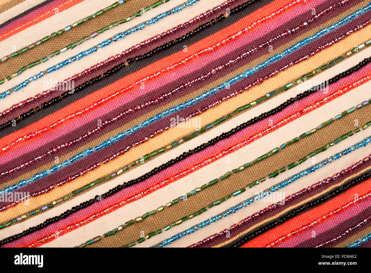 Colorful lined fabric with beads texture background Stock Photo - Alamy