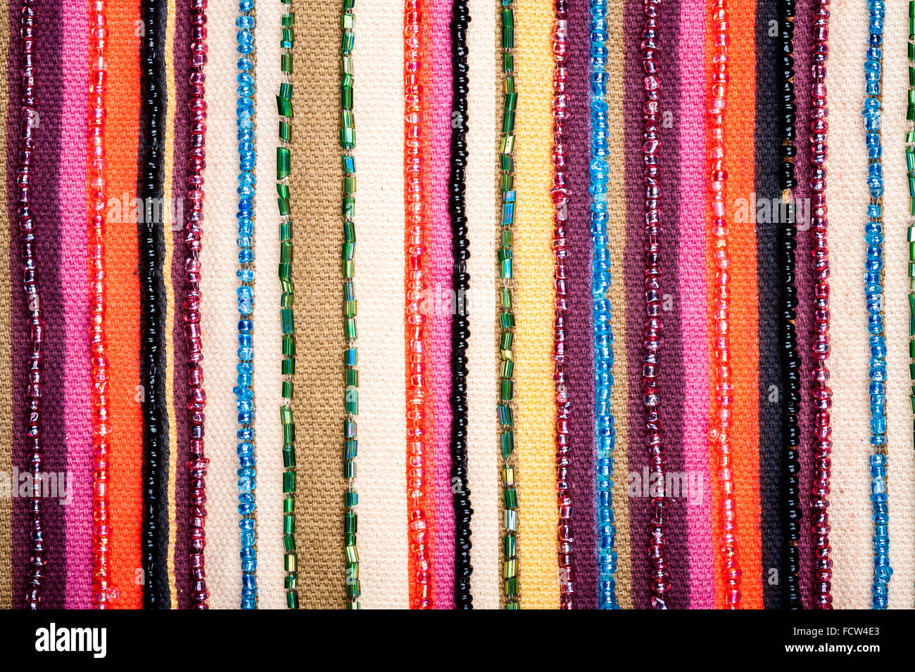 Colorful lined fabric with beads texture background Stock Photo - Alamy