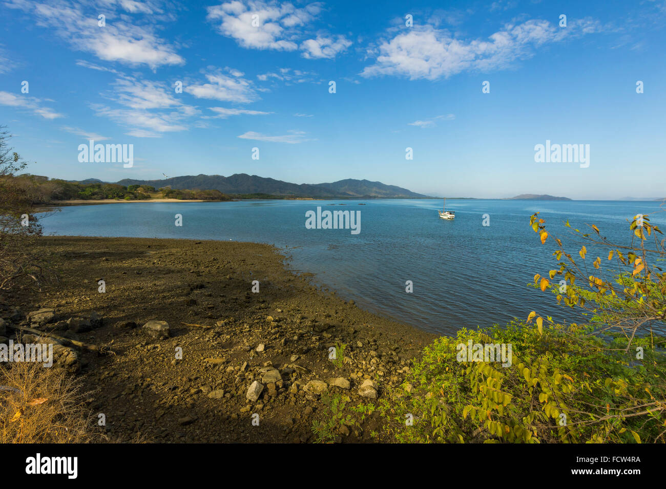 Yacht moored at Playa Naranjo on the south coast of the Gulf of Nicoya ...