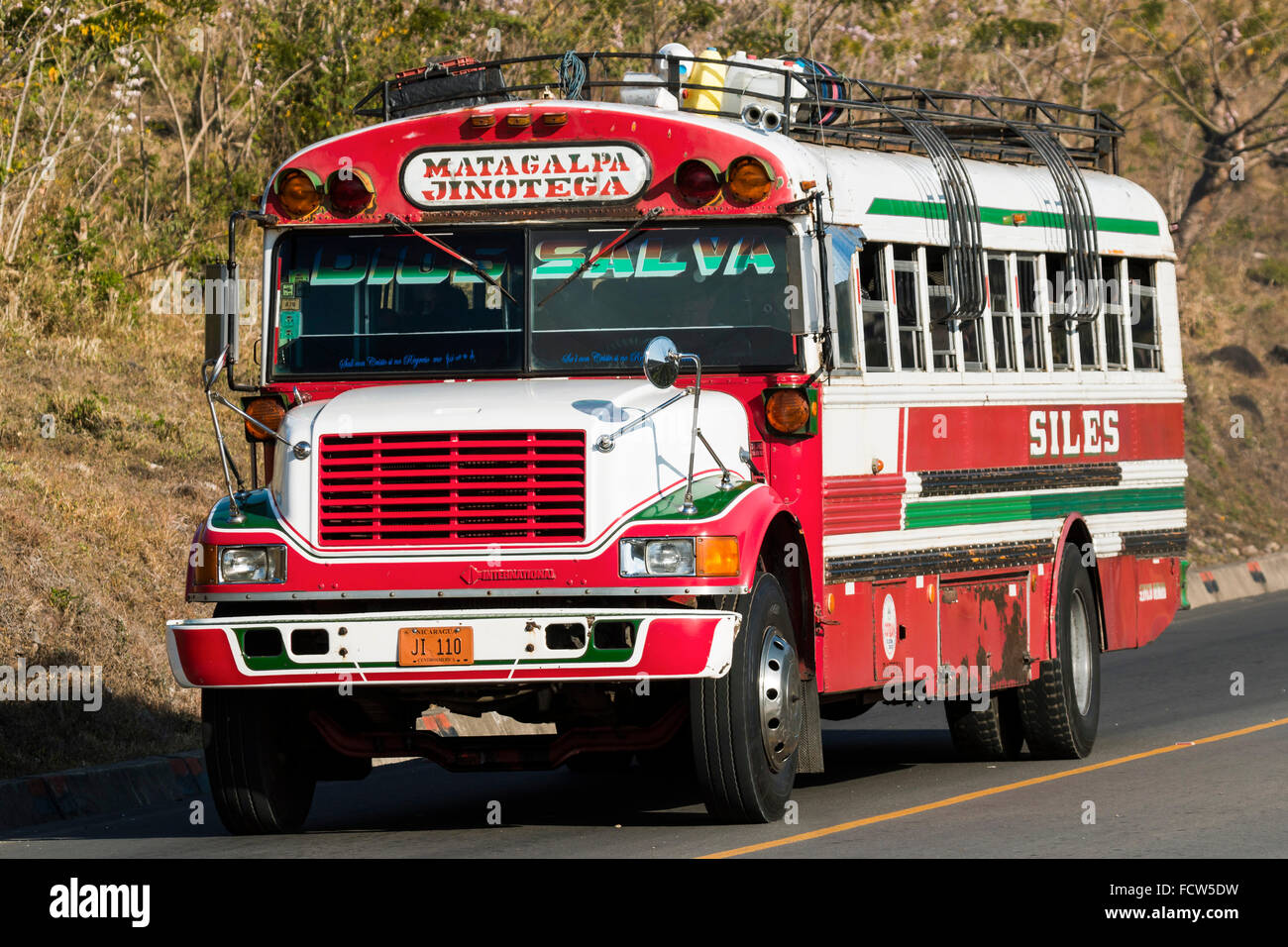 Colourful bus en route from the northern city of Matagalpa to Jinotega ...