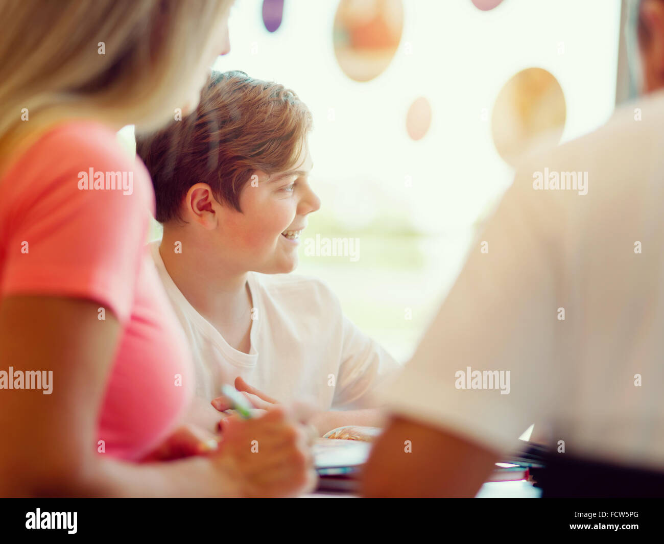 Boy in library with books Stock Photo - Alamy