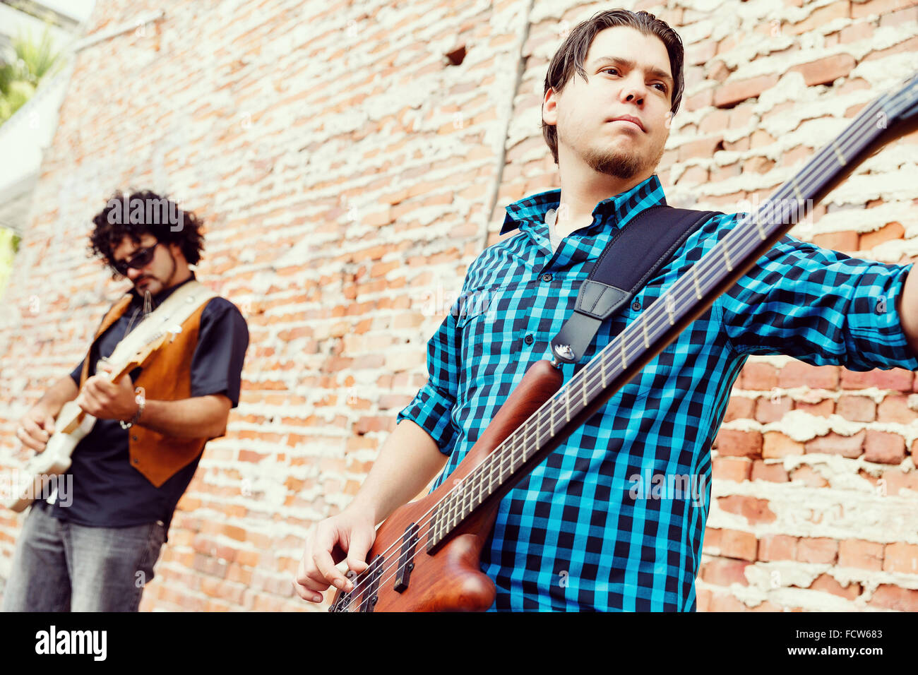 A street musician tuning his instrument Stock Photo - Alamy