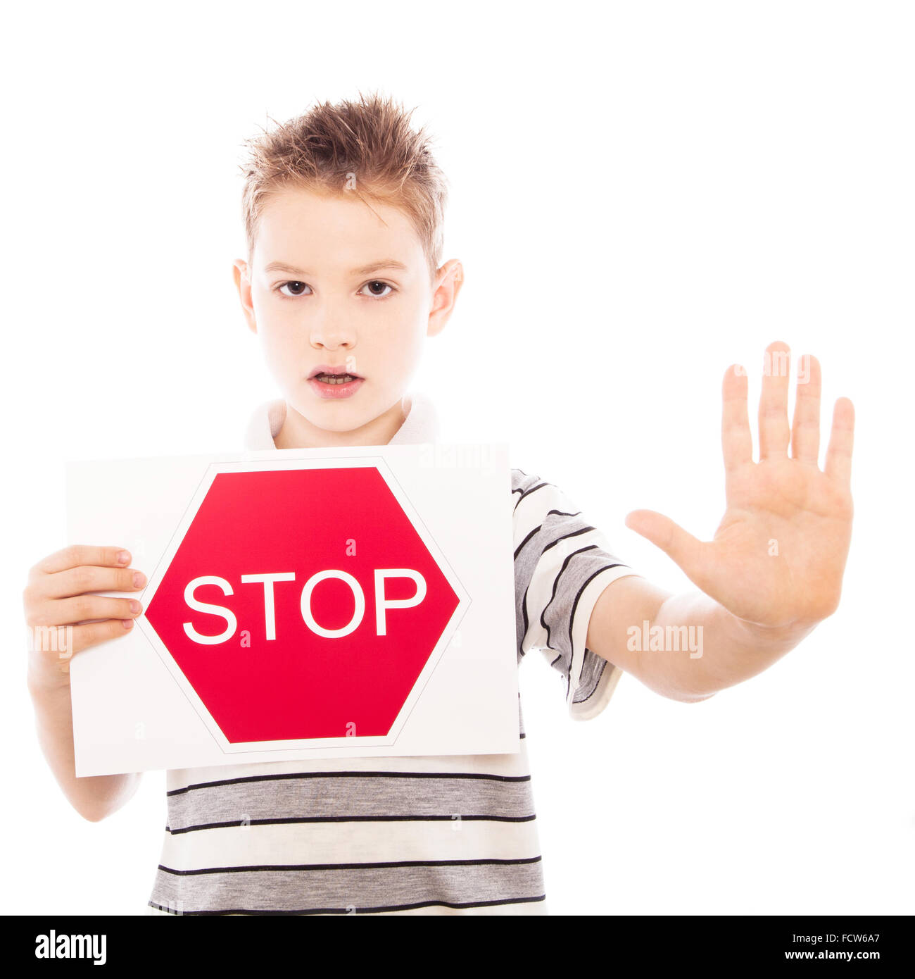 Happy boy with stop sign Stock Photo - Alamy