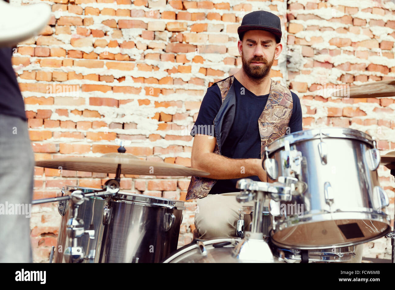 A street muscian playing drums Stock Photo - Alamy