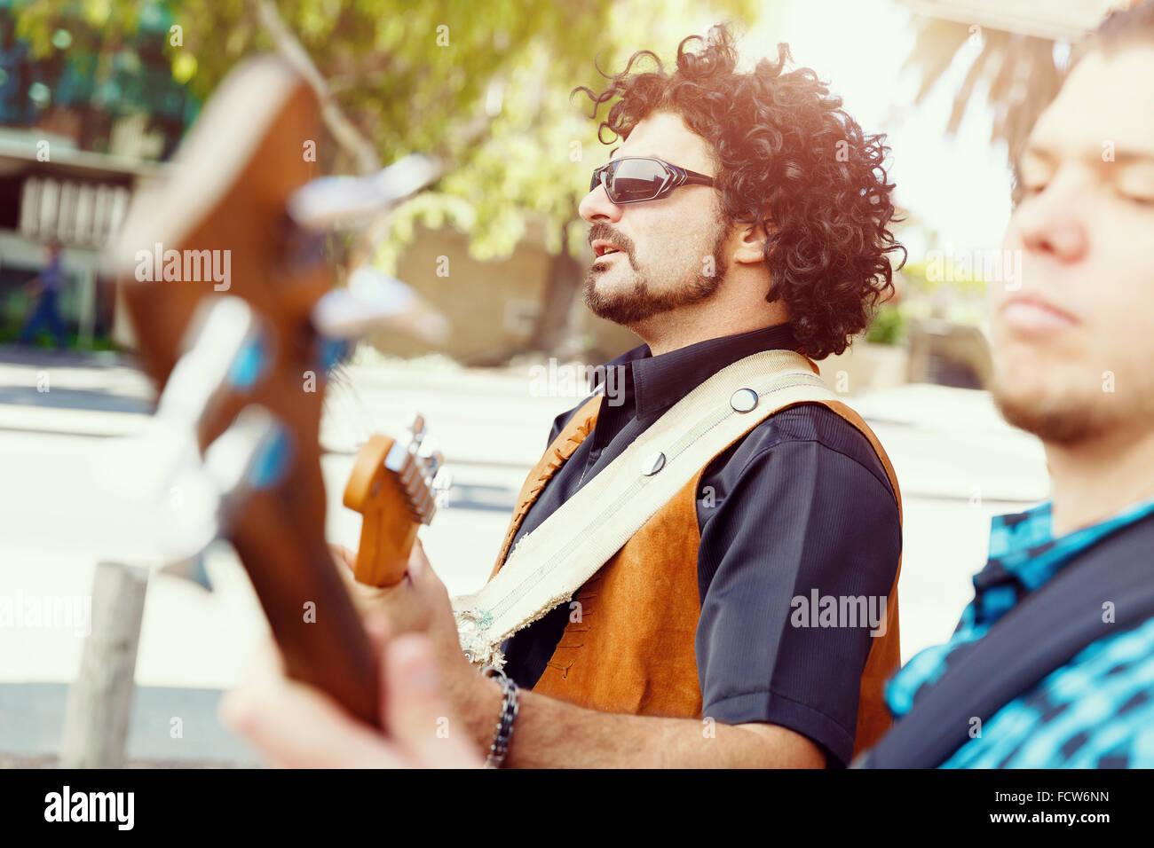 Band of musicians playing in the street Stock Photo - Alamy