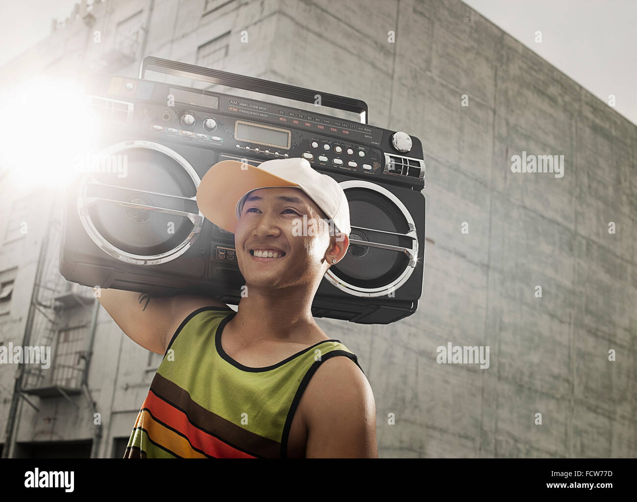 A young person with a boombox on the street of a city Stock Photo - Alamy
