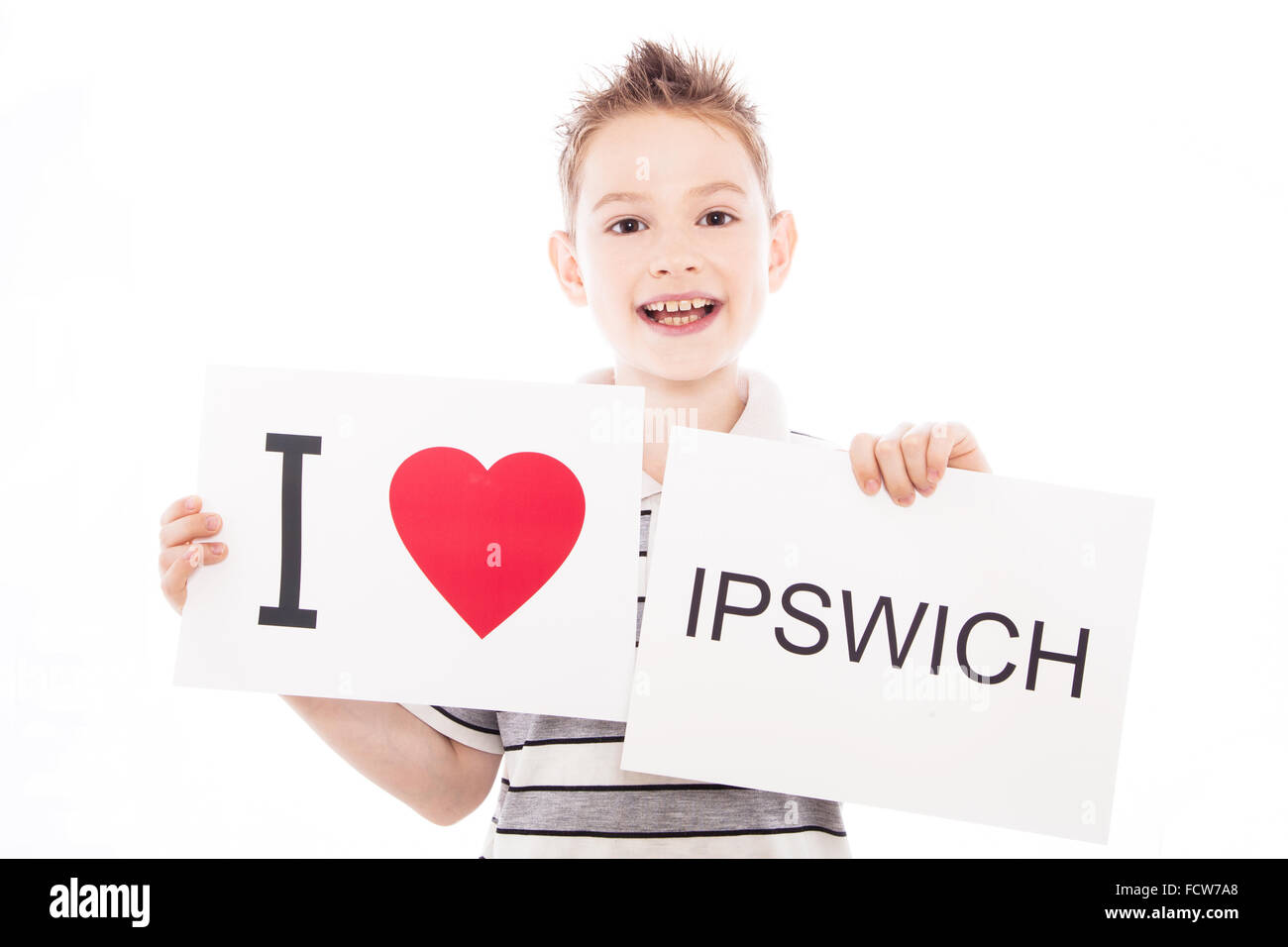 Boy with Ipswich city sign Stock Photo - Alamy