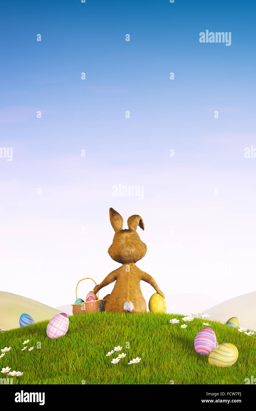 A cute Easter bunny sitting on a hill surrounded by easter eggs Stock ...