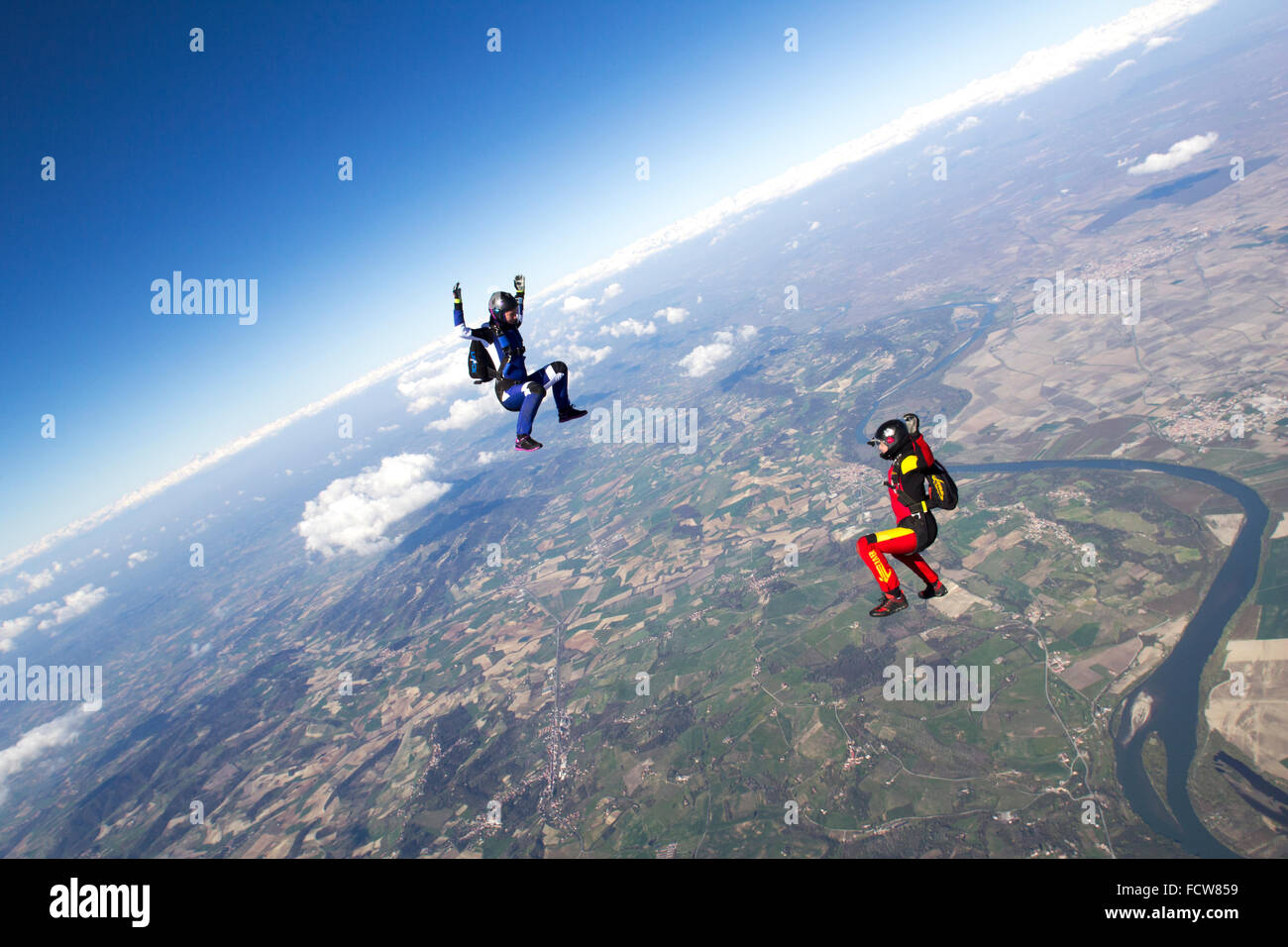 This skydive freefly team is training the sit-fly formation together ...