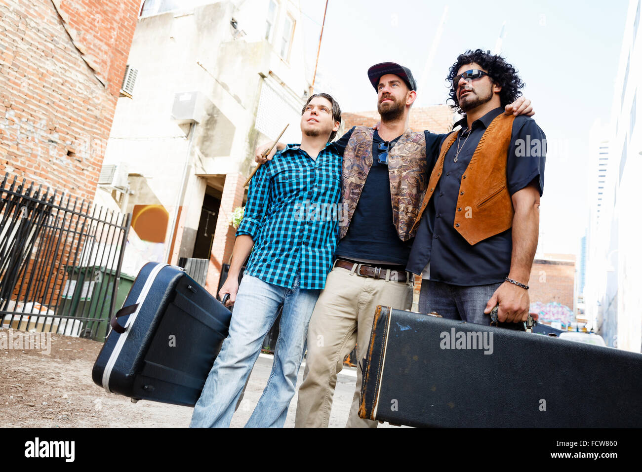 Band of musicians walkimg in the street Stock Photo - Alamy