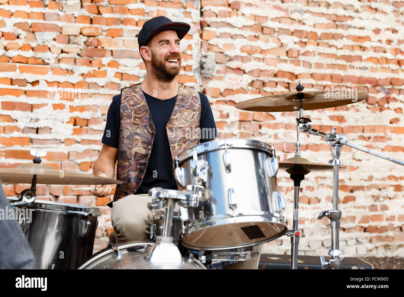 A street muscian playing drums Stock Photo - Alamy