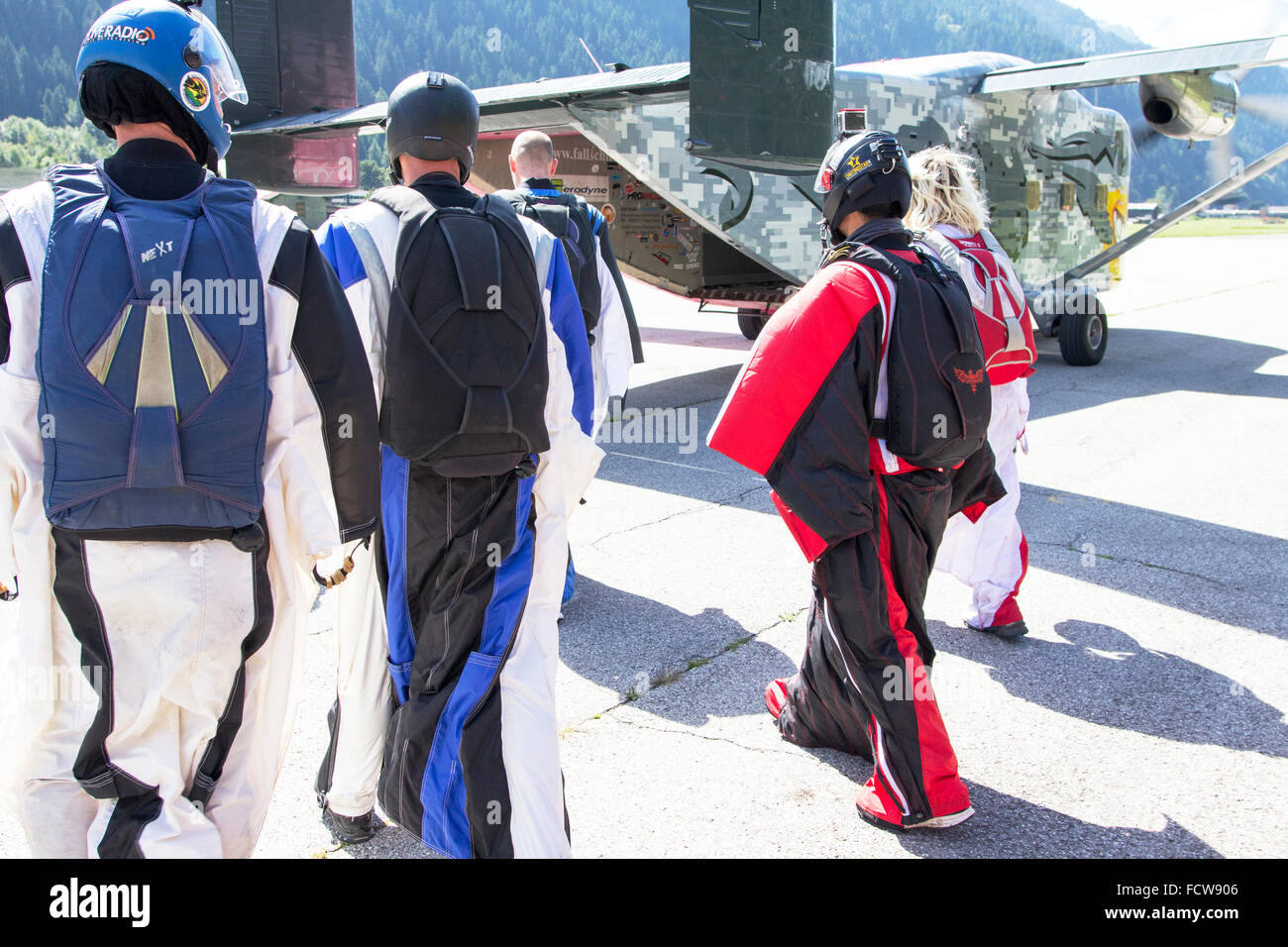 Wingsuit pilots are entering by the tail-door the aircraft. Afterwards ...