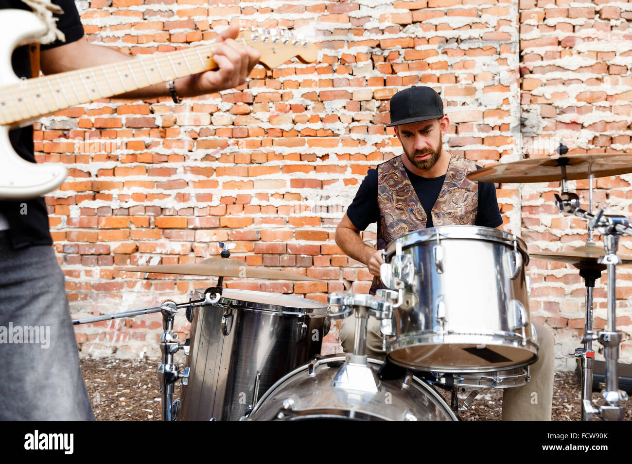 A street muscian playing drums Stock Photo - Alamy