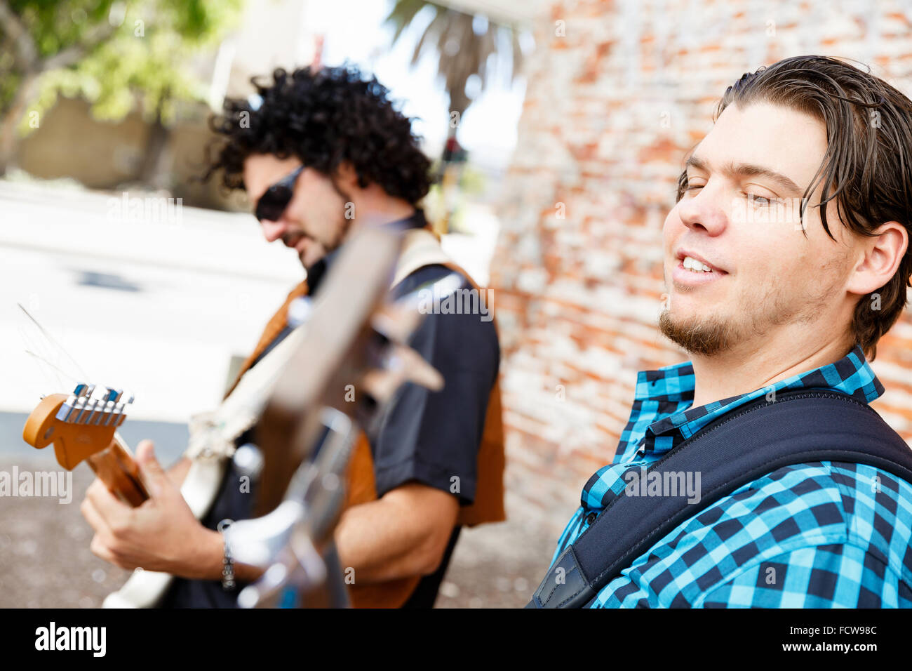 Band of musicians playing in the street Stock Photo - Alamy