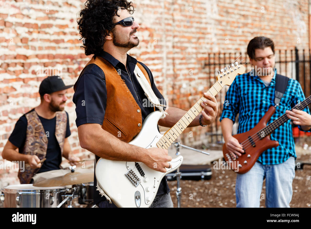 Band of musicians playing in the street Stock Photo - Alamy